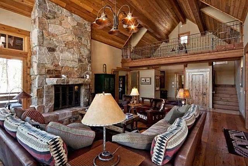Rustic Great Room with Exposed beam & stone fireplace | Zillow Digs ...