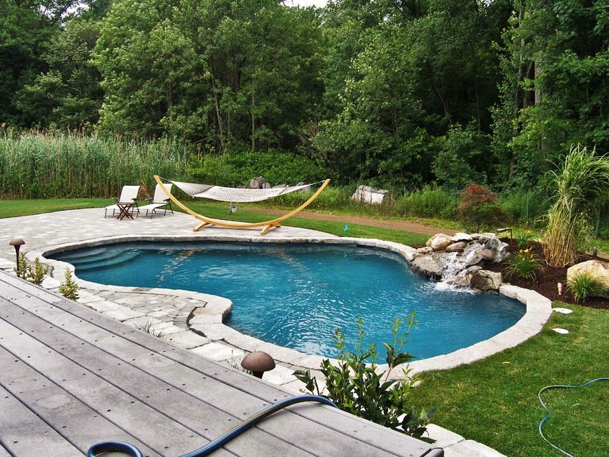 Rustic Swimming Pool with Pathway by Aqua Pool & Patio | Zillow Digs ...
